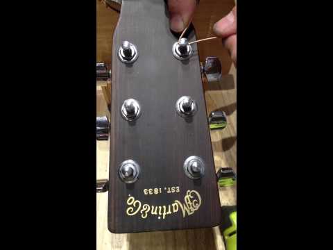 Stringing an acoustic or electric guitar