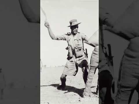 A Gurkha soldier demonstrates how to use the kukri fighting knife, 1944