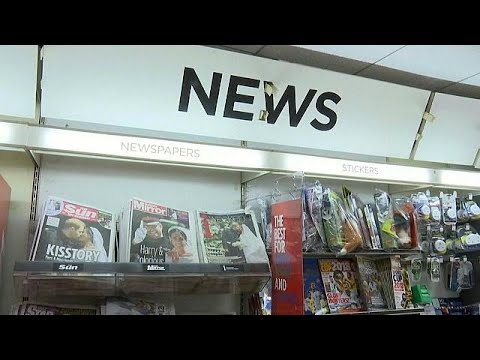 Locals, tourists rush to gather UK newspapers commemorating royal wedding in Windsor