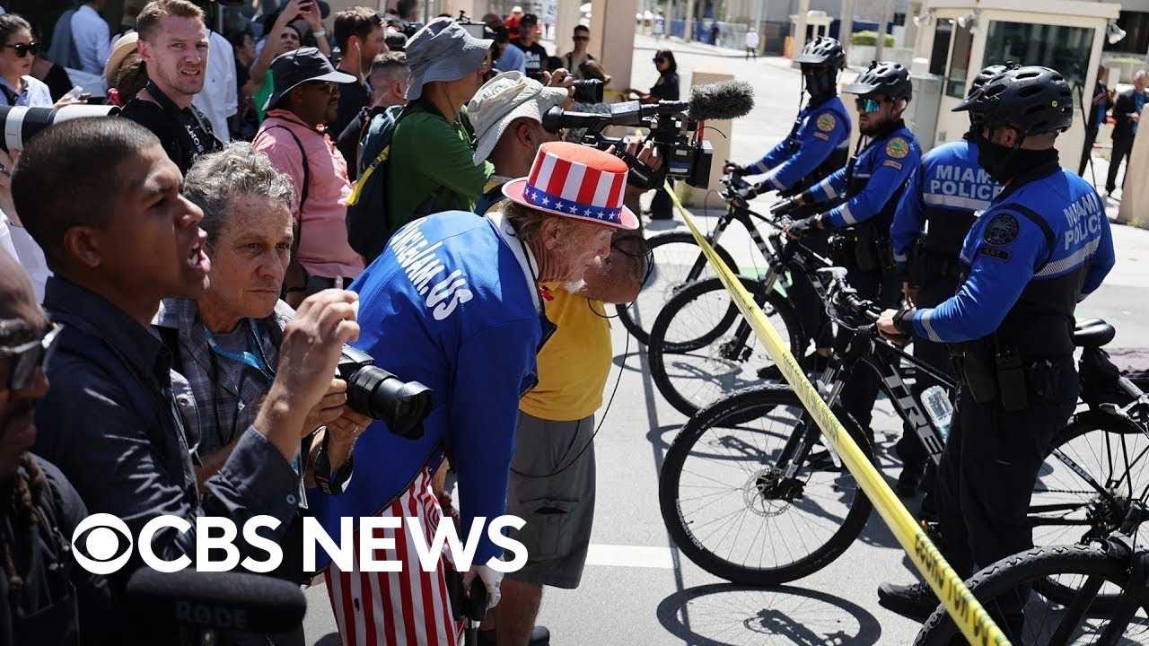 Protesters arrive, tensions rise before Trump arraignment