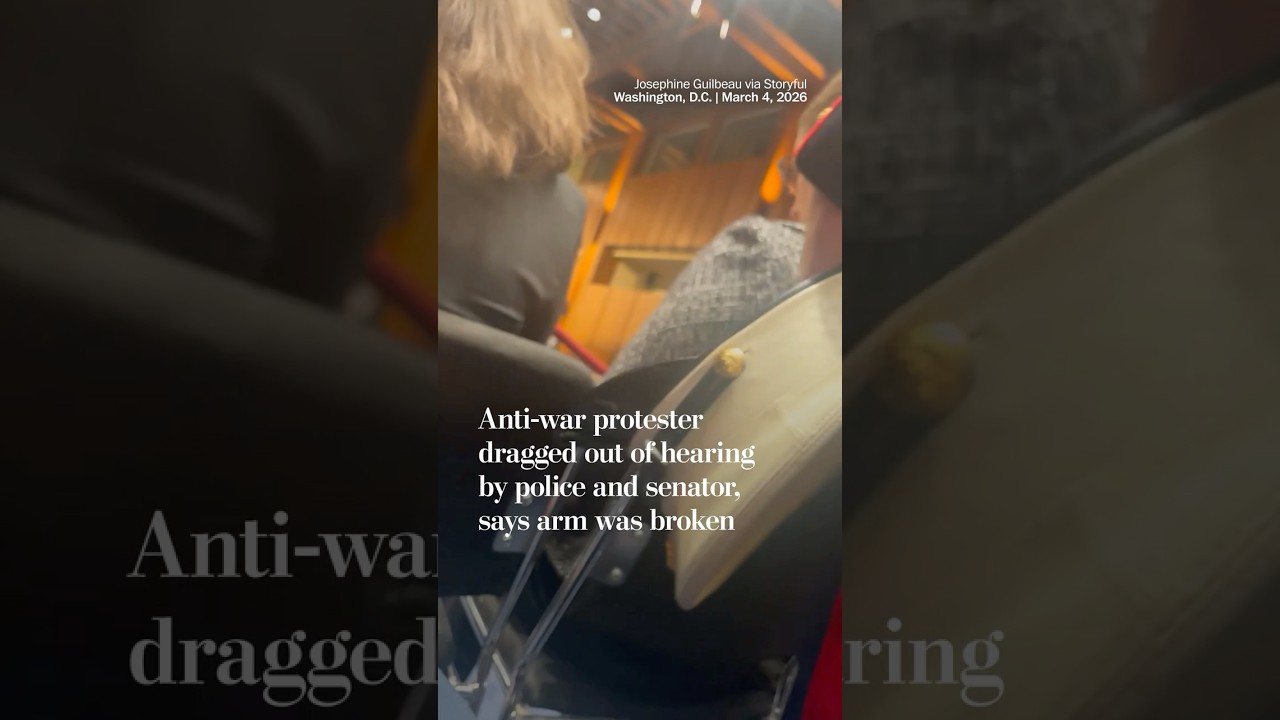 Anti-war protester dragged out of hearing by police and senator, says arm was broken