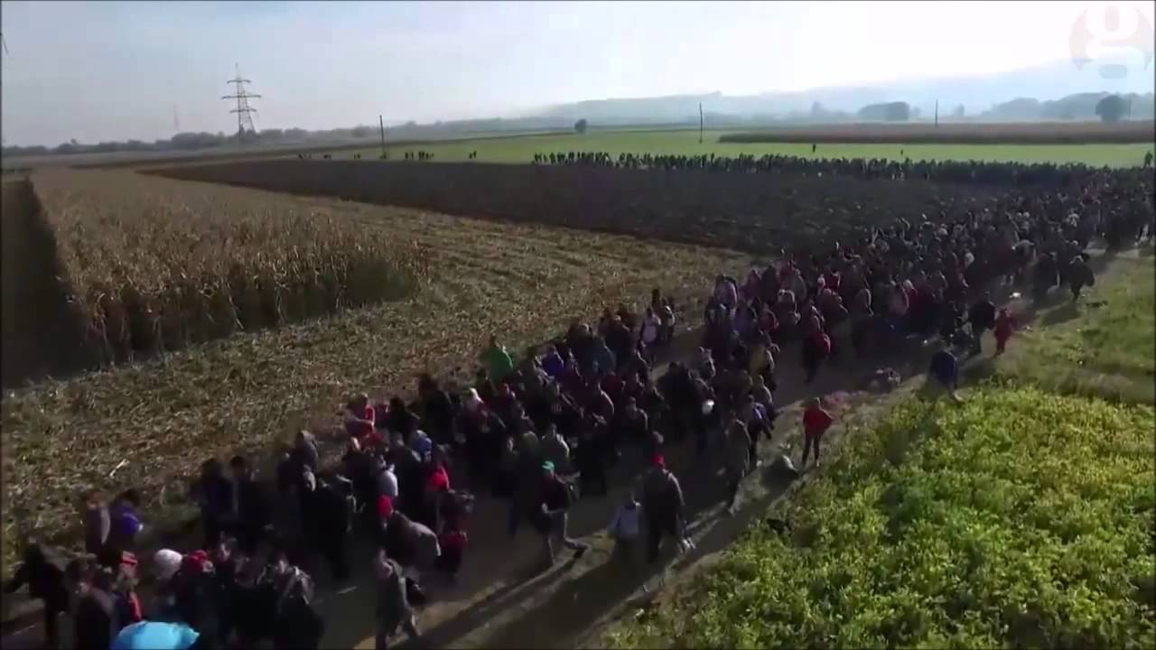 Refugees walking across the fields of Europe...