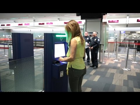 CNET News - High-tech kiosks speed you through customs in minutes