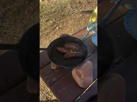 Sizzling lamb sausages cooked on open fire in Utah #lamb #sausage #camping