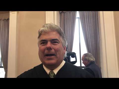 New Erie County Judge David Ridge reacts after taking his oath of office