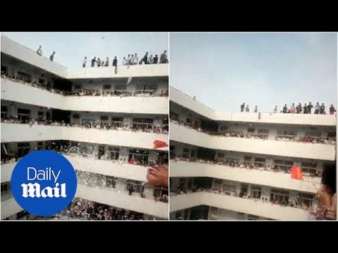 Hundreds of Chinese high school students shred books to confetti