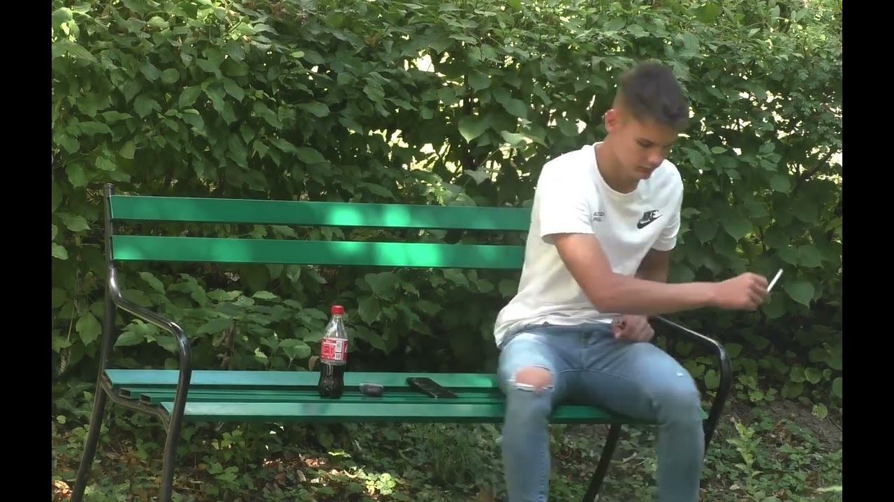 Boy smoking bench