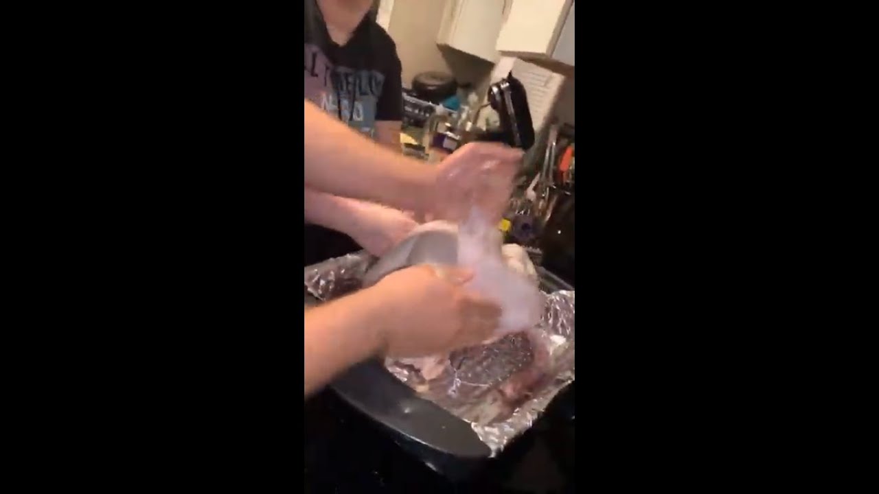 Man Slaps The Turkey While Preparing It