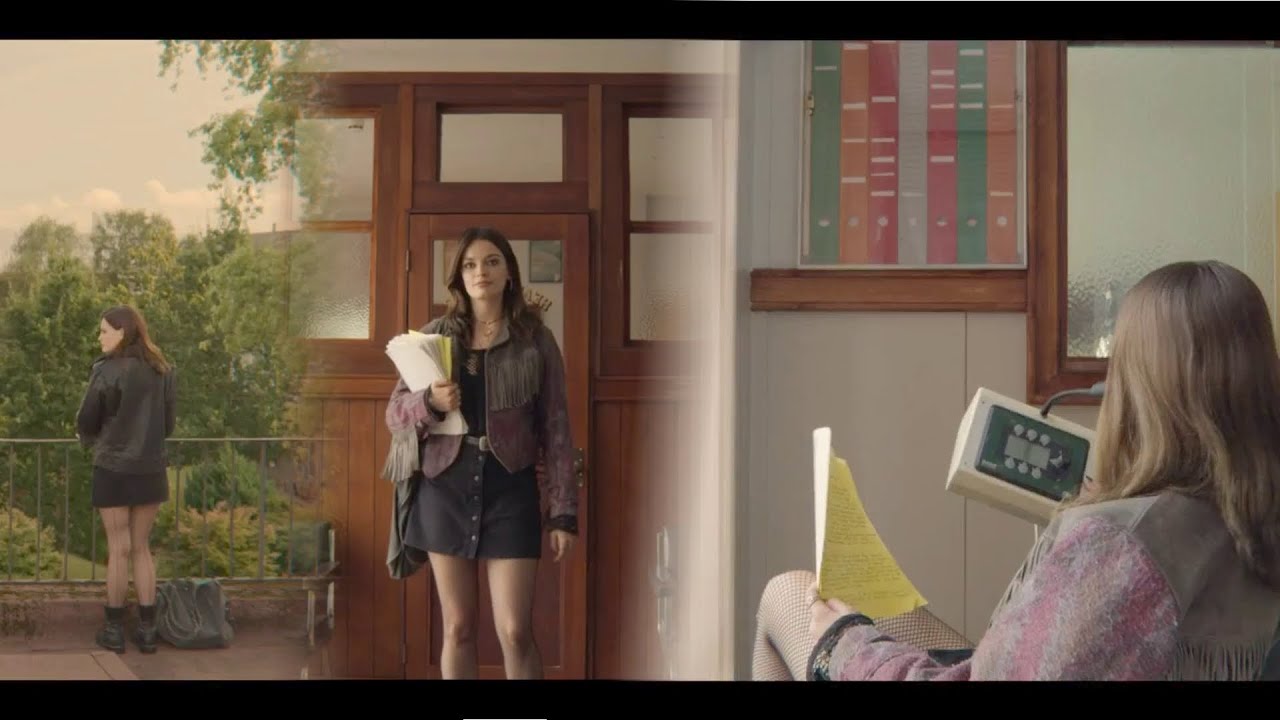 Emma Mackey has sexy legs wearing a miniskirt with black, seamed pantyhose in Sex Education s02e01