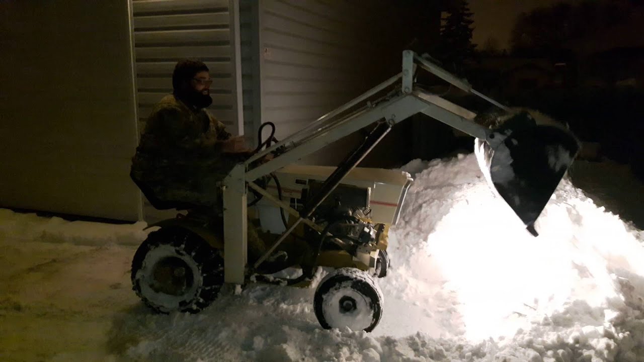 Sears Suburban Loader Plowing Deep Snow