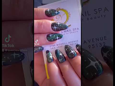 Blue Cat-eye Nail Polish on Almond Shape Nails with twinkle stars design. @queeniesnailspa