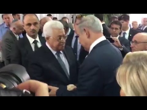 Abbas, Netanyahu shake hands at Shimon Peres' funera...