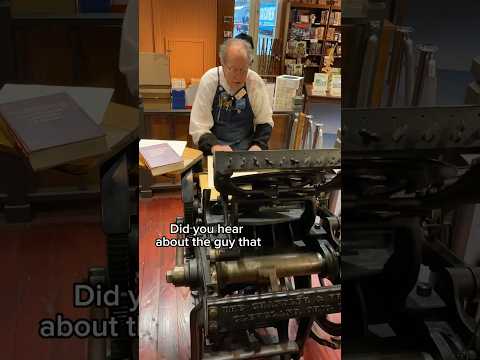 Howard shares a dictionary joke while letterpress printing with our jobbing press.