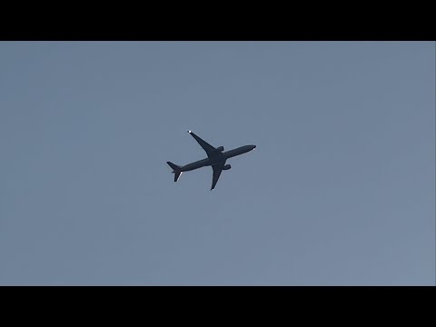 Air China Boeing 777W [B-2045] flying above at evening