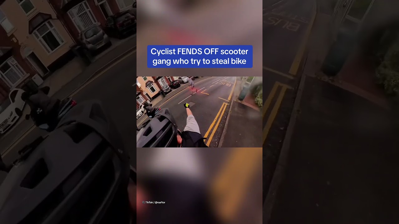 Moment brave cyclist fends off scooter gang that tries to steal his bike