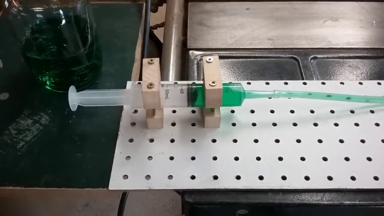 Fun with hydraulics.  Depressing a push button remotely.