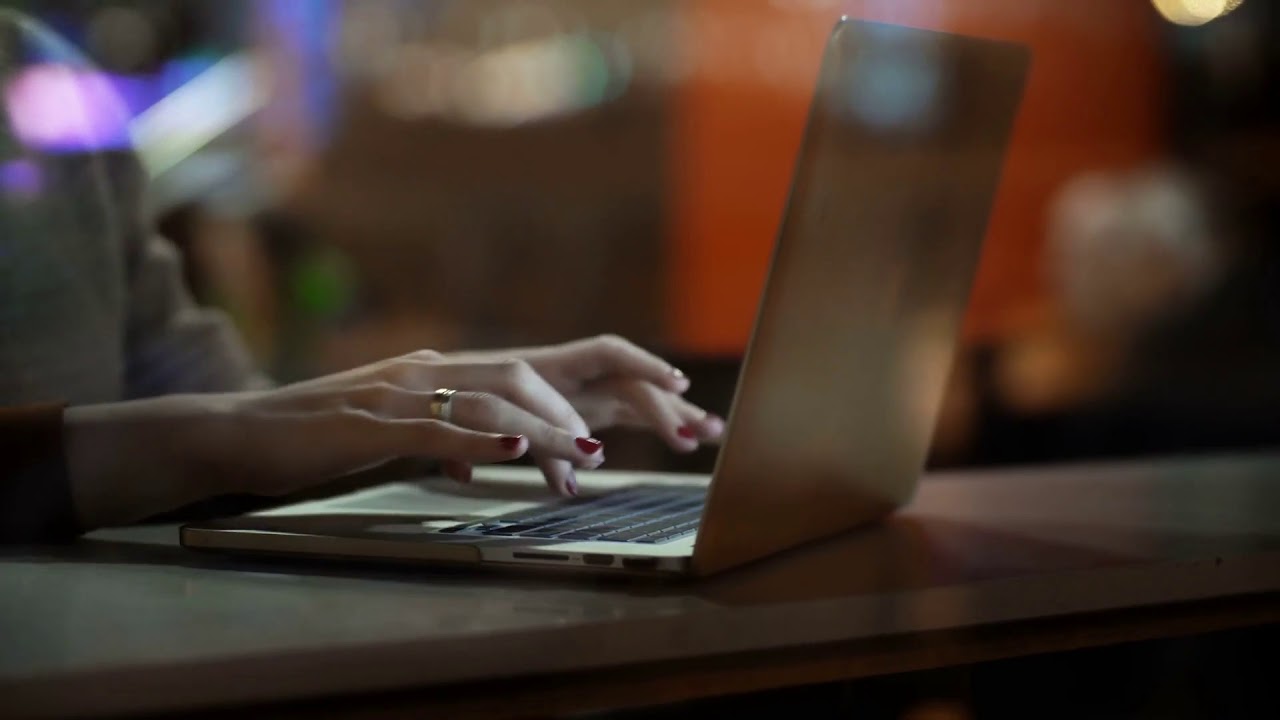 videoblocks close up view of female hands typing on laptop businesswoman sitting on the table and us