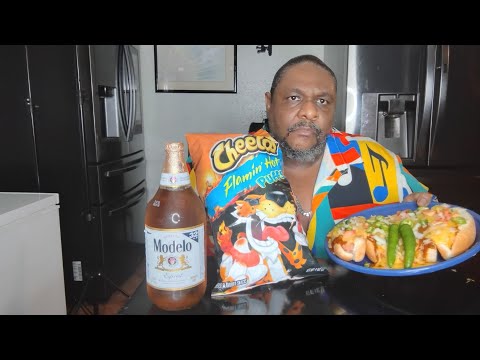 4 Sloppy azz hotdogs a big bag of Cheetos Flaming Hot hot Puffs and a 32oz bottle of Modelo Beer