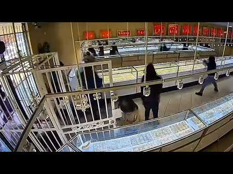 Video shows chaotic California jewelry store robbery where owner mistakenly shoots wife