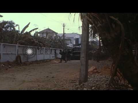 US soldiers and MPs (Military Police) follow behind V-100 commando car and fire a...HD Stock Footage