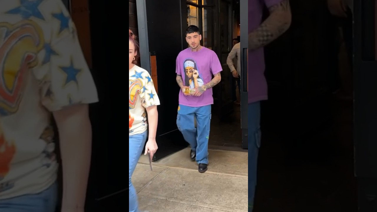 Zayn Malik shows off summer style combining a purple shirt with denim cargo pants! #zayn #zaynmalik