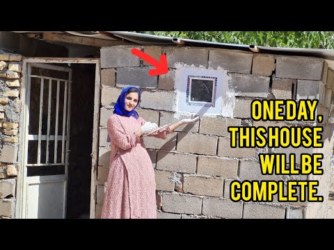 Farzaneh is still building; she installed the window, and one day this house will be complete