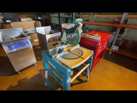 LOT 54: MAKITA FLIPPER DUAL MITRE SAW AND TABLE SAW