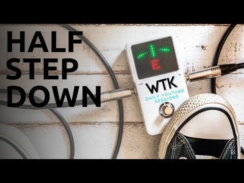 How to tune your guitar down a half step down and why? / Eric Roberts