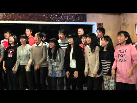 Japanese schoolgirls performing a Maori song after a Hangi feast