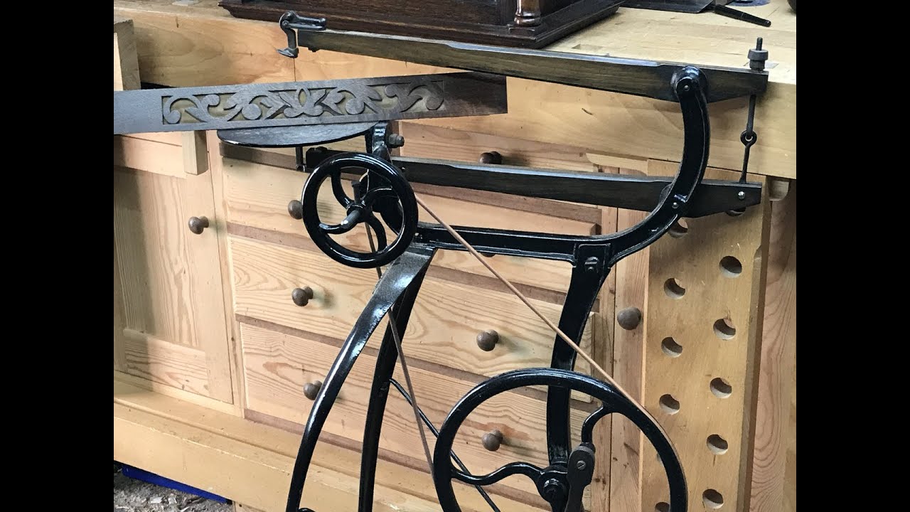 Cutting a clock fret on an antique scroll saw.