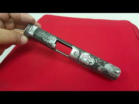 Intricately lasrr engraved 1911 firearms slide on the QM50PLUS laser system