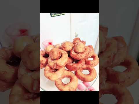 Delicious donut delights: Glazed donut holes and rings for a sweet treat#donuts
