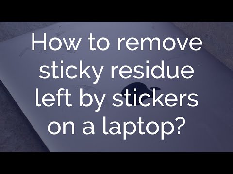 How to remove sticky residue left by stickers on a laptop?
