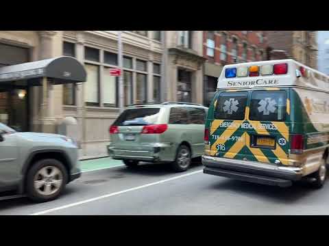 SENIOR CARE EMS AMBULANCE RESPONDING EAST 13TH STREET IN UNION SQUARE AREA OF MANHATTAN, NEW YORK.
