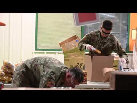 Michigan National Guard helps Food Gatherers pack emergency food boxes for local pantries