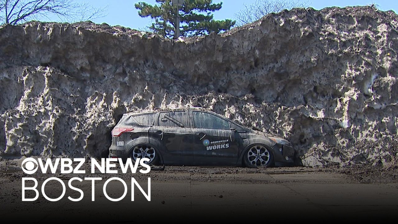 Melting snow pile reveals crushed Somerville DPW car