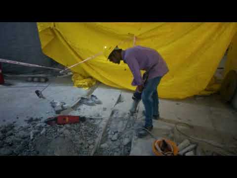 Ganmar RCC Concrete Breaking Contractors-Hitachi PH65A machine using floor breaking