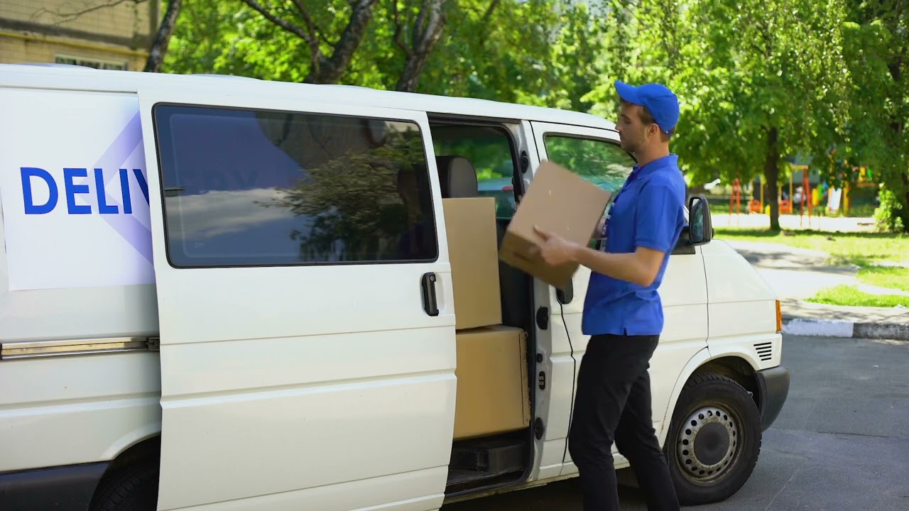 Male Delivery Worker Taking Cardboard Box From Van stock videos #freestockfootage