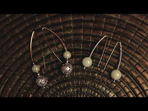 silver earrings blue agate old stone background hd footage