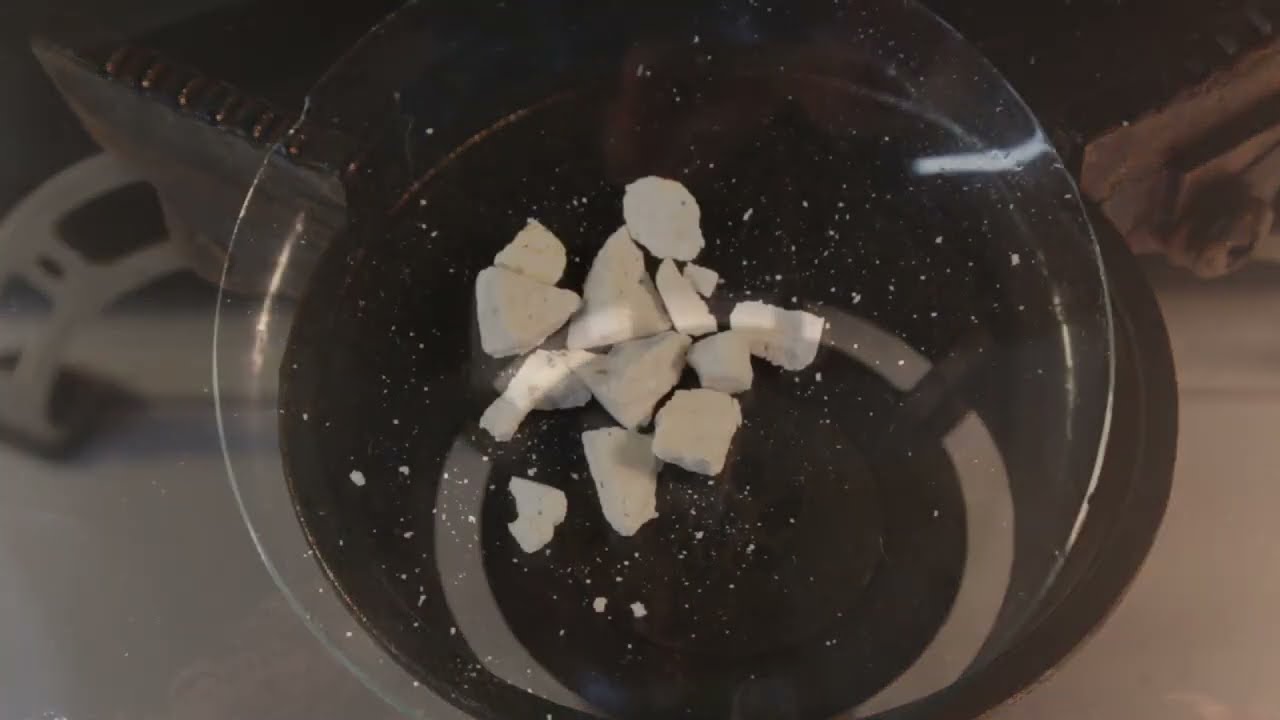 CaCO3 thermal decomposition; reaction of CaO with H2O;  testing Ca(OH)2 formed with phenolphthalein