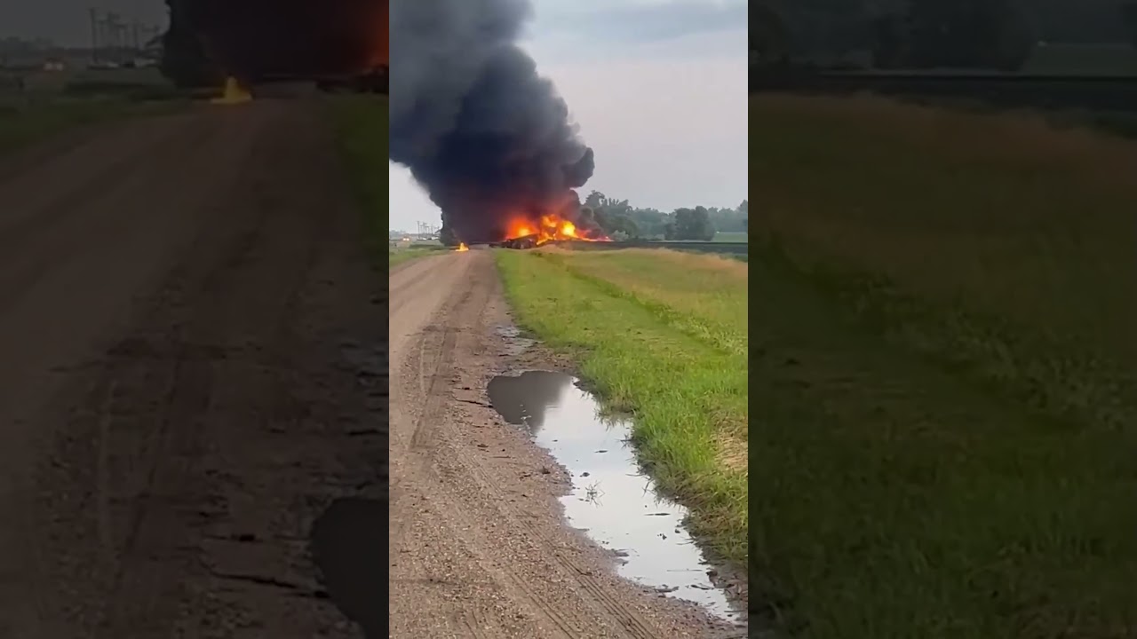 Train carrying hazardous material derails and catches fire in North Dakota