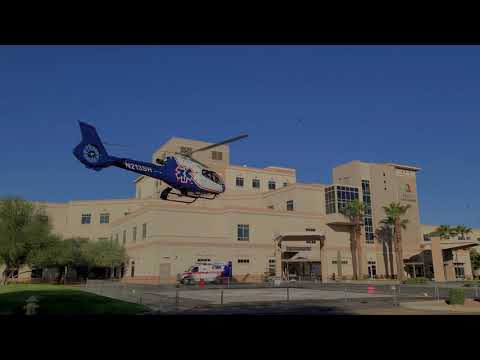 Airmethods N213SH air ambulance arriving at Abrazo West Campus emergency room.