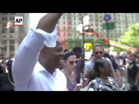 Adams at parade: Honor heroes with pay equity