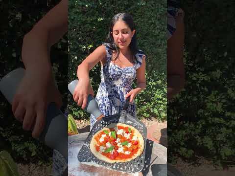 Pizza with smoked tomato sauce, loads of garlic and cherry tomatoes