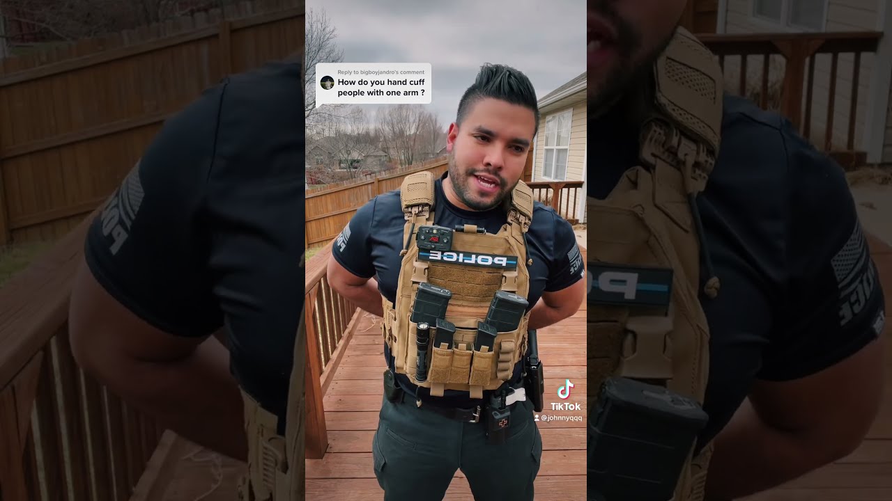 Putting handcuffs on someone with 1 arm!