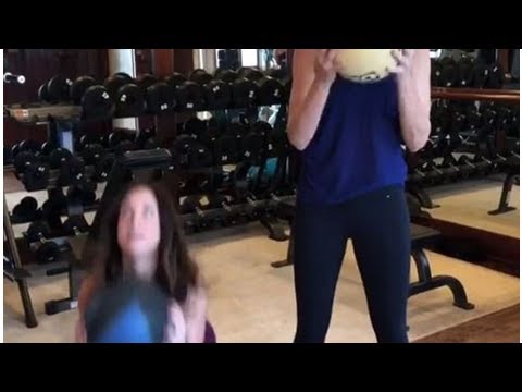 News | 'Up and at 'em': Cindy Crawford is all smiles while working out with her personal trainer at
