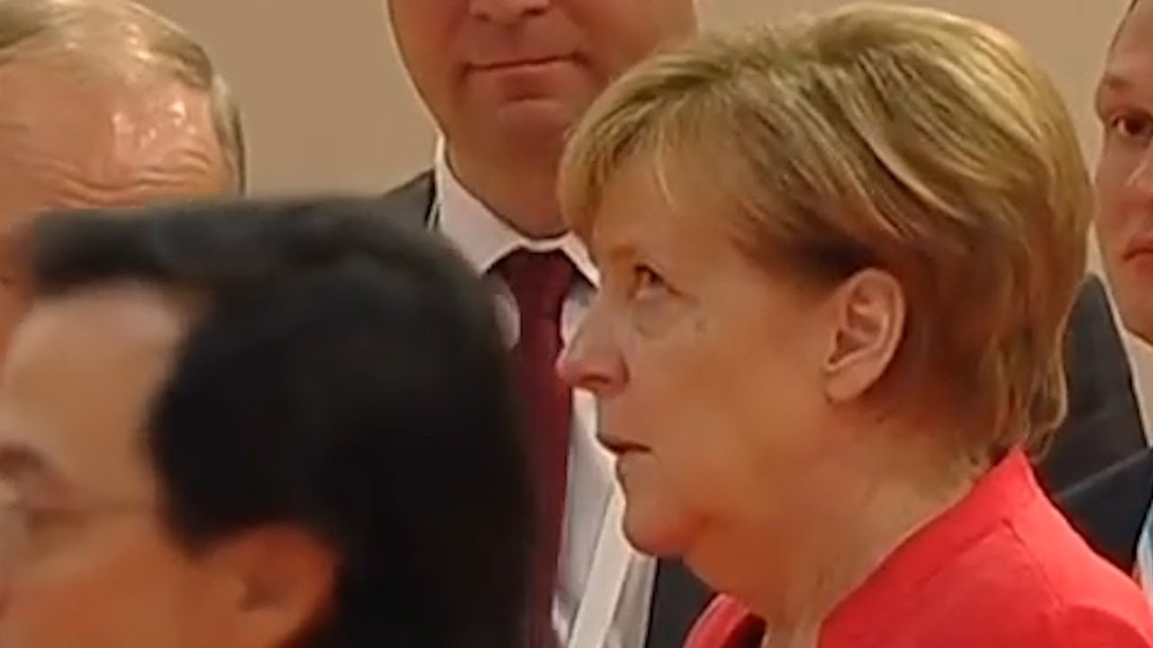 'Wir schaffen das!': Boris Johnson draws eyeroll from Angela Merkel by ...