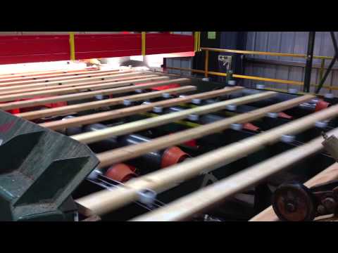 Weyerhaeuser lumber boards moving quickly through machinery