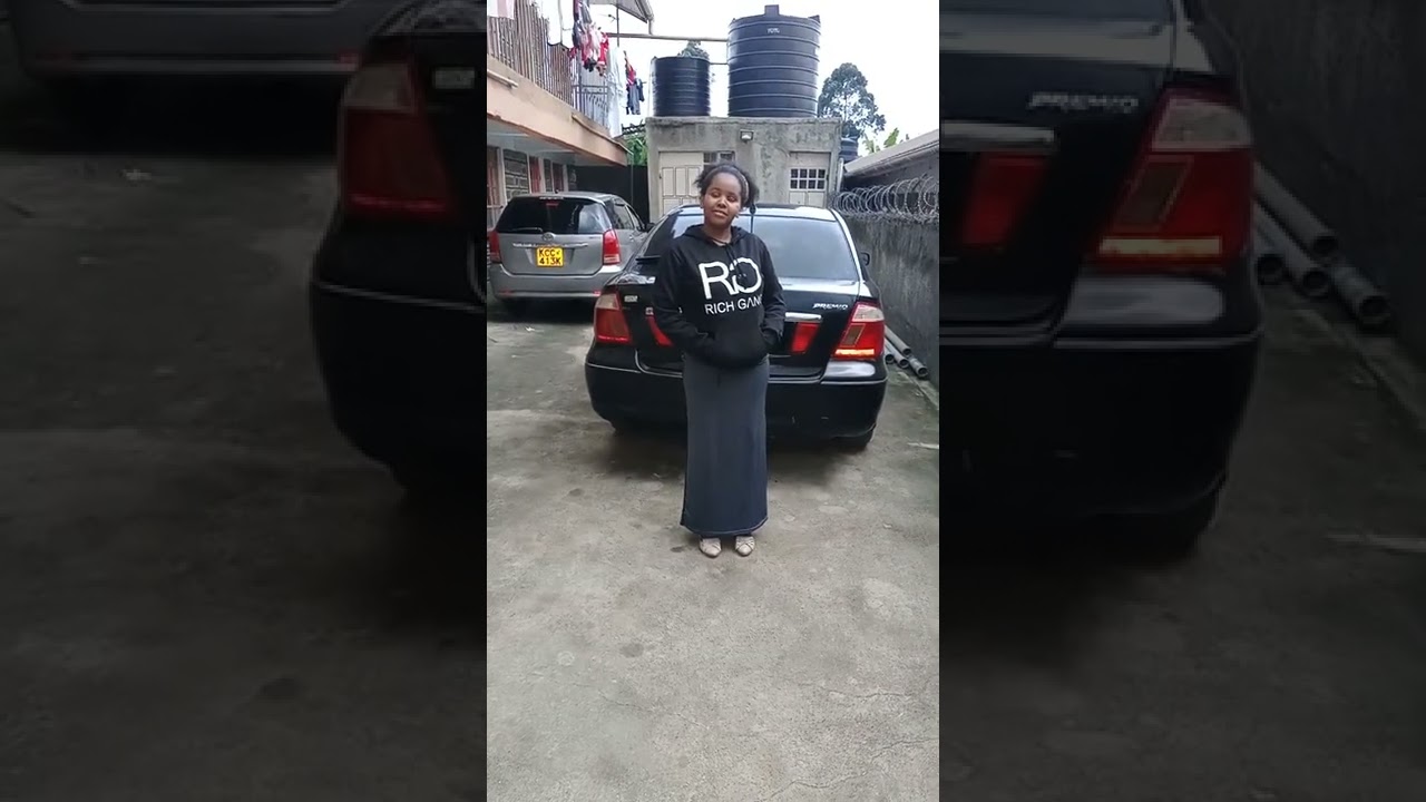 Young Mama Myles beside our first Car ( Premio 240)