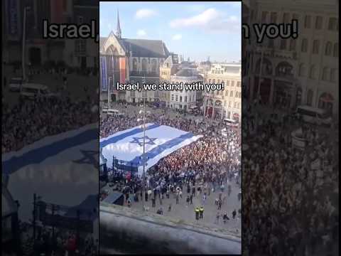 HUGE crowd in the Netherlands displays a massive Israeli flag in solidarity with the Jewish state.